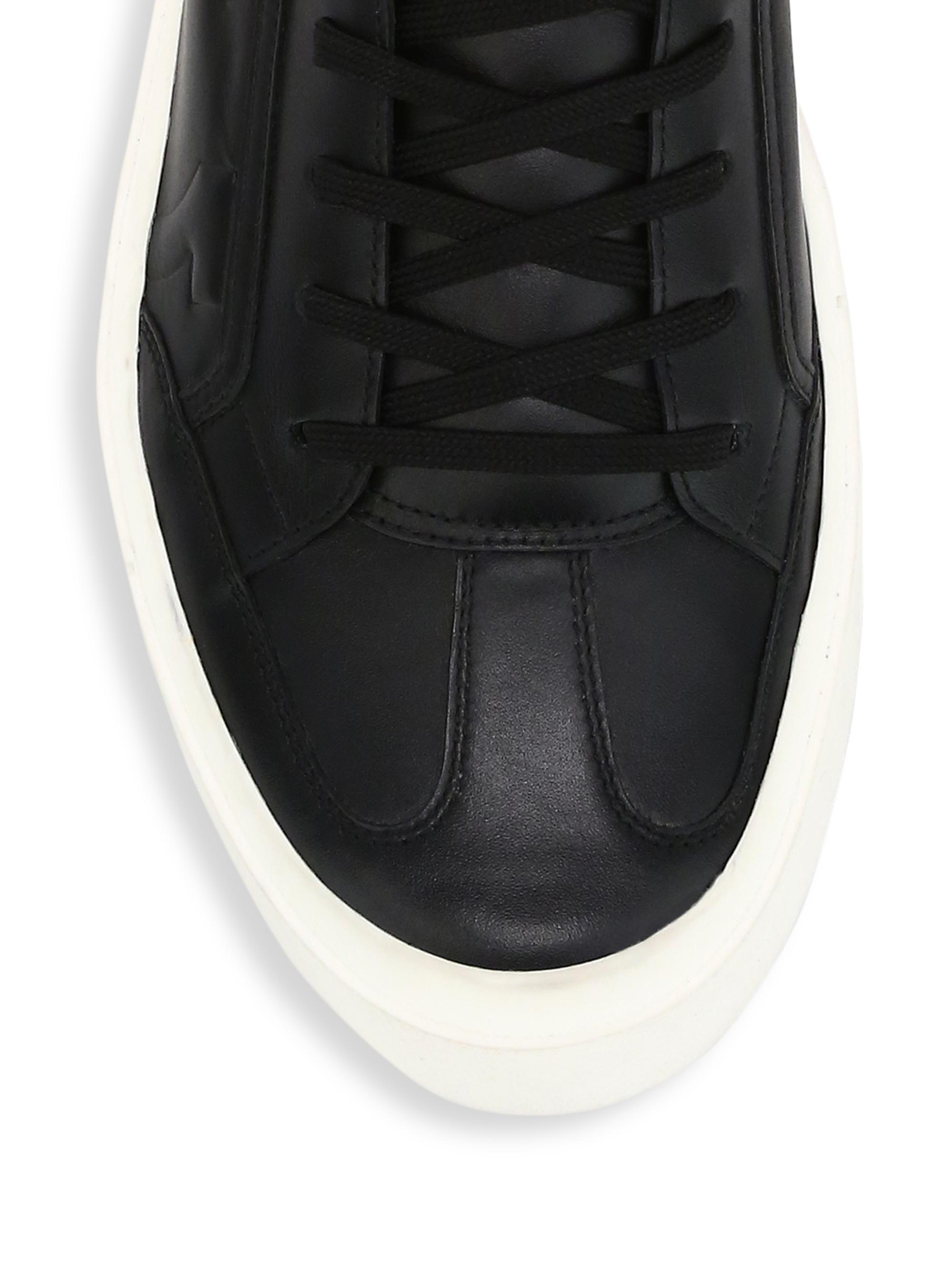Shop FERRAGAMO Borg Quilted Logo Leather Runners | Saks Fifth Avenue